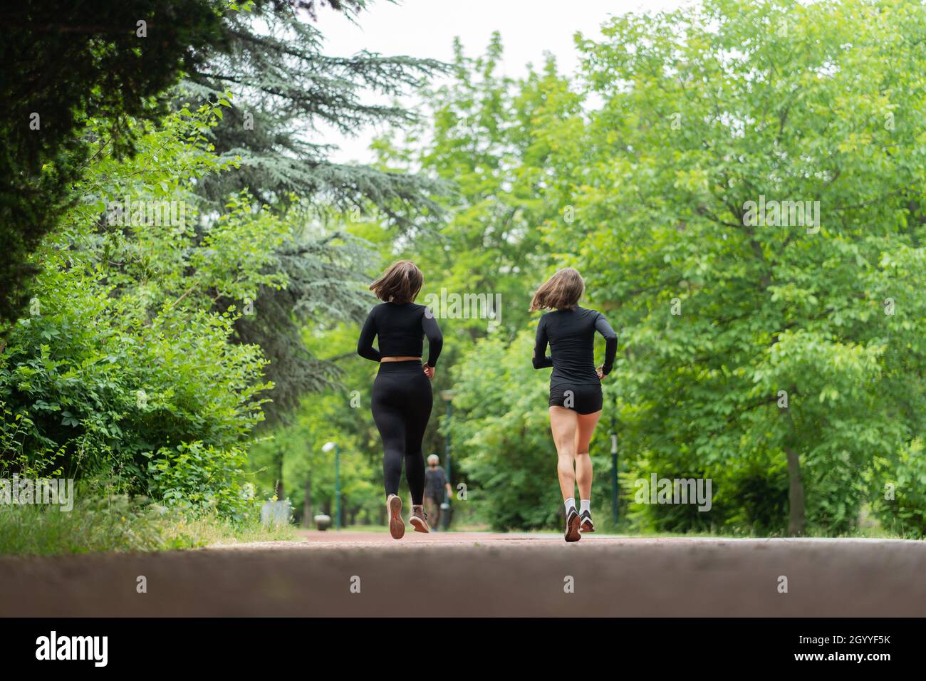 Beautiful and attractive girls are running on the running track Stock ...