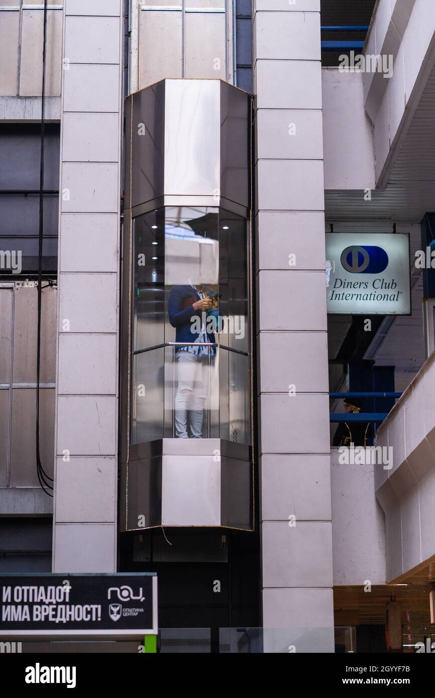 Handsome businessman is working while going up the elevator Stock Photo ...