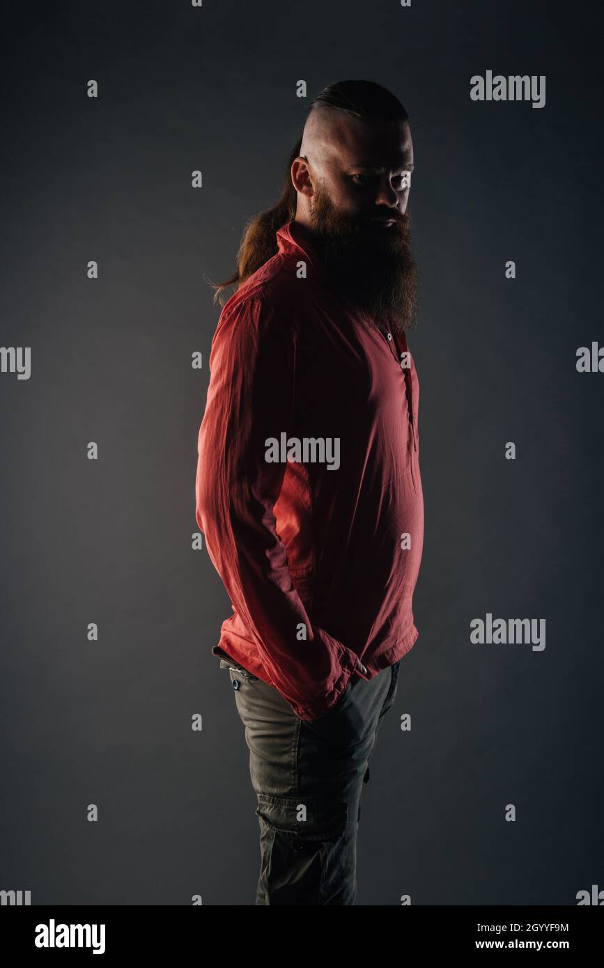 Beautiful strong nordic man with stylish hairstyle and beard on a ...