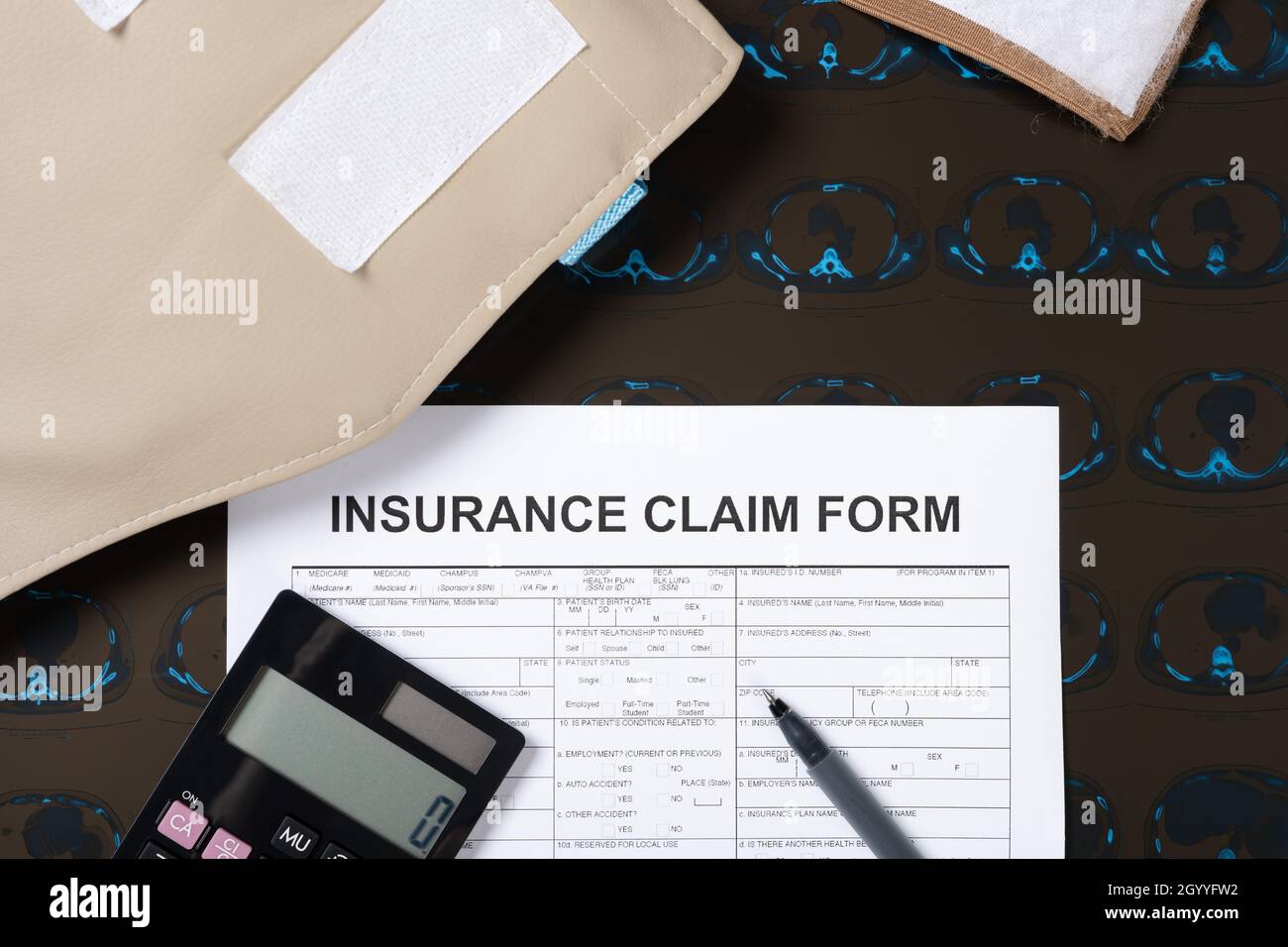 top view insurance claim form with CT film medical and insurance ...