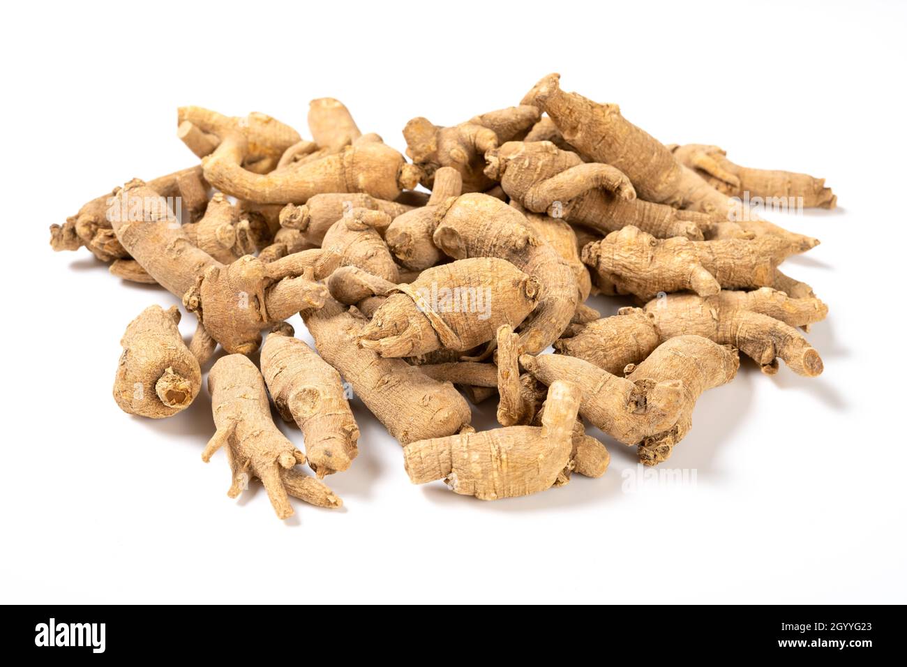 angle view ginseng stack up on a white background Stock Photo - Alamy