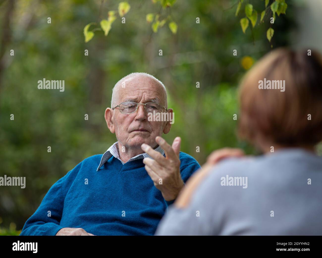 Woman listening senior friend talking hi-res stock photography and ...