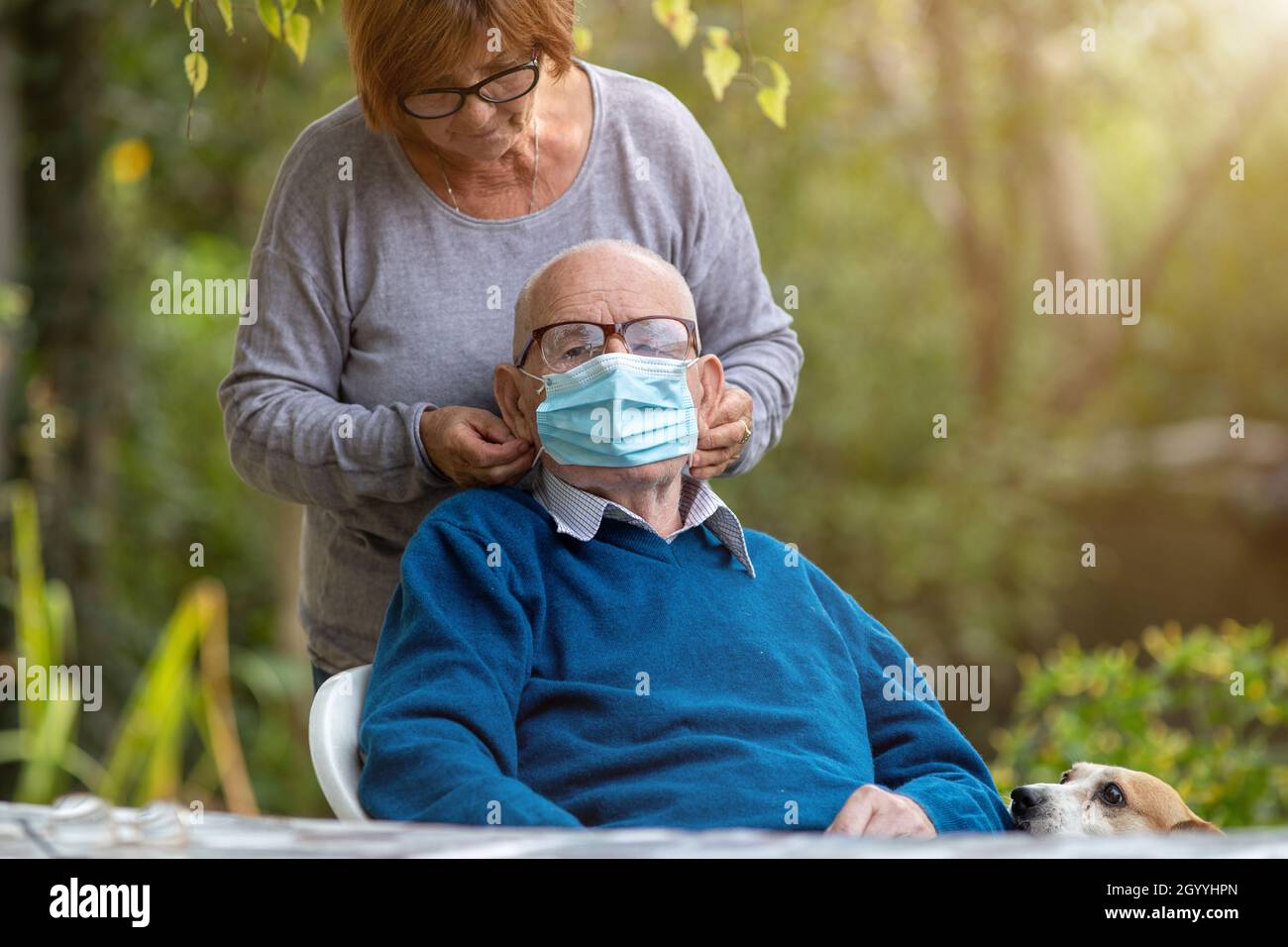 Senior couple putting on protective hi-res stock photography and images ...