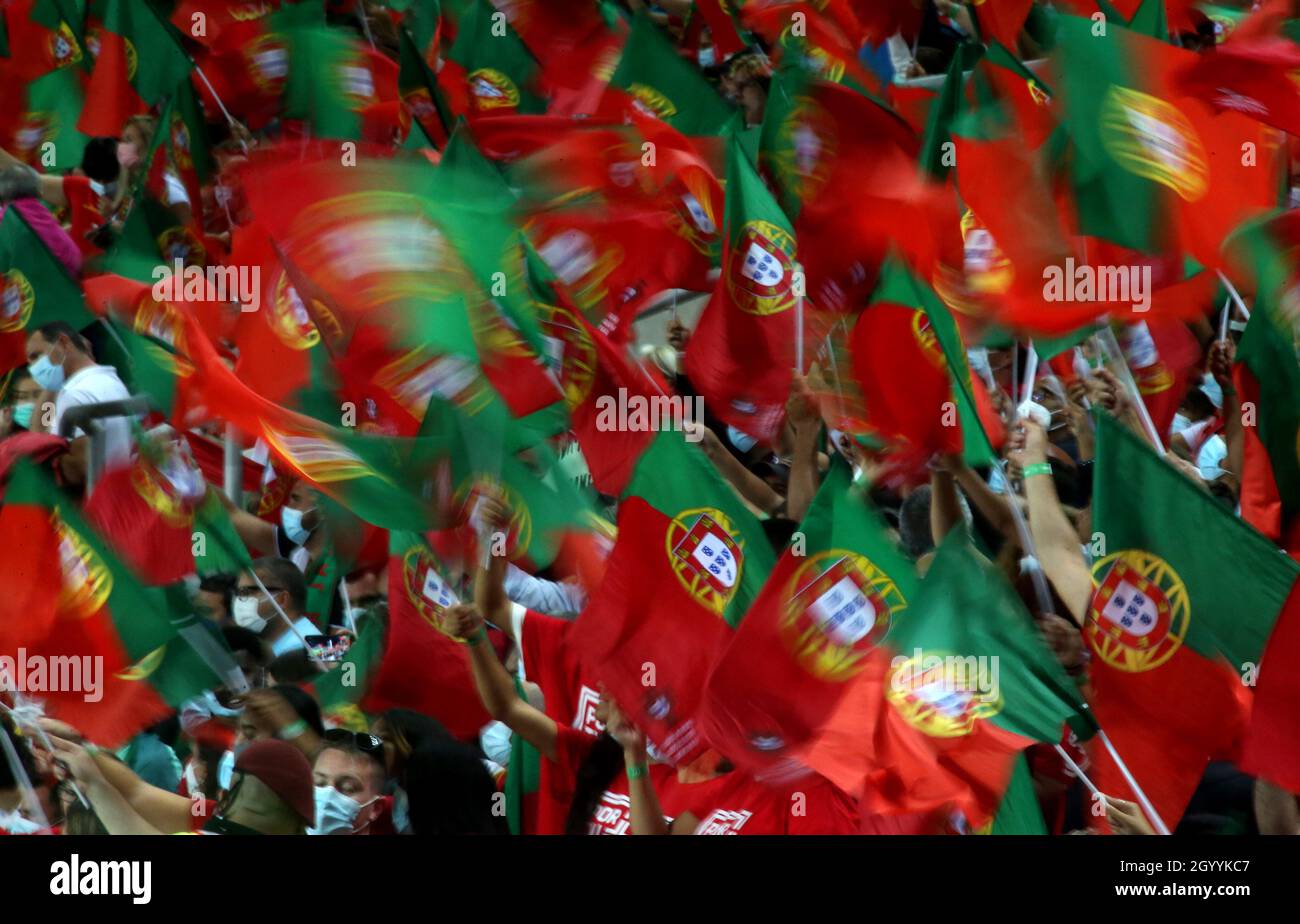 FARO, PORTUGAL - OCTOBER 09: Fans of Portugal celebrates with a flag ...
