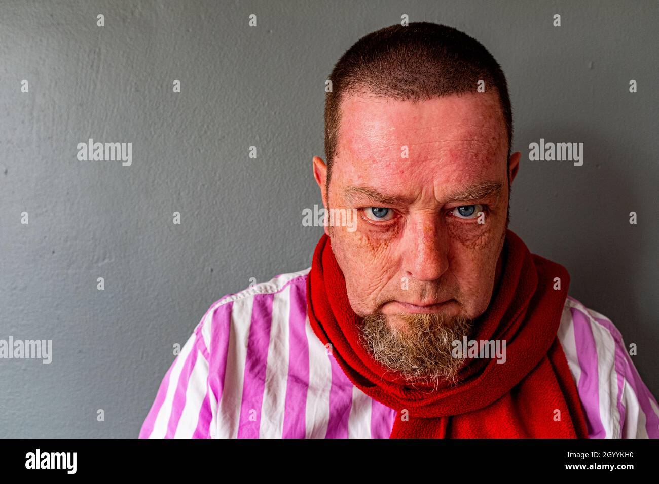 Selfie / Self Portrait of an Angry Man in front of a Grey, Studio Wall ...