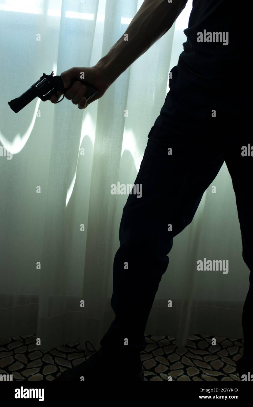 Spy thriller book cover design with man holding pistol gun Stock Photo ...