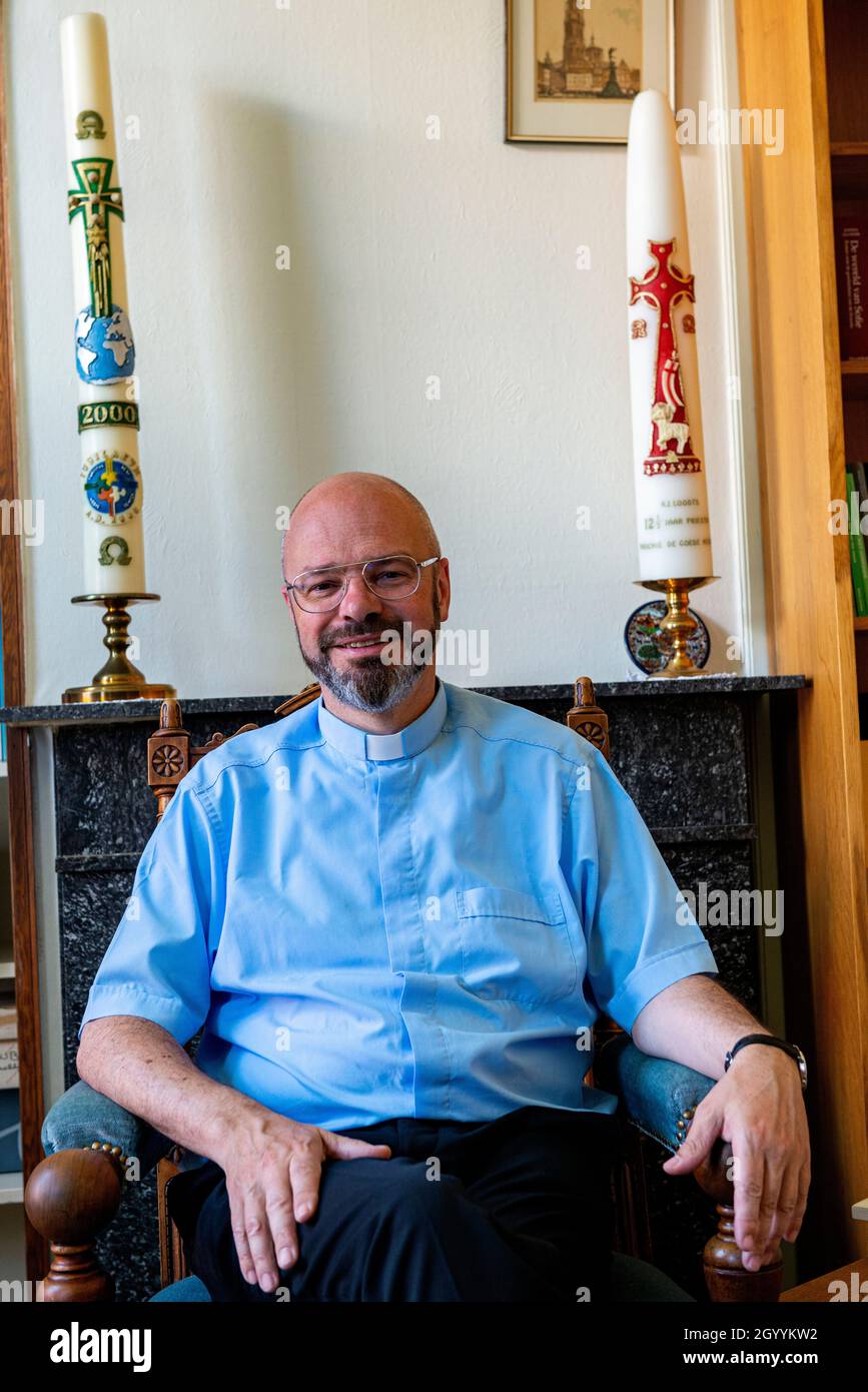 Tilburg, Netherlands. Living Room Portrait of a 56 year old Catholic ...