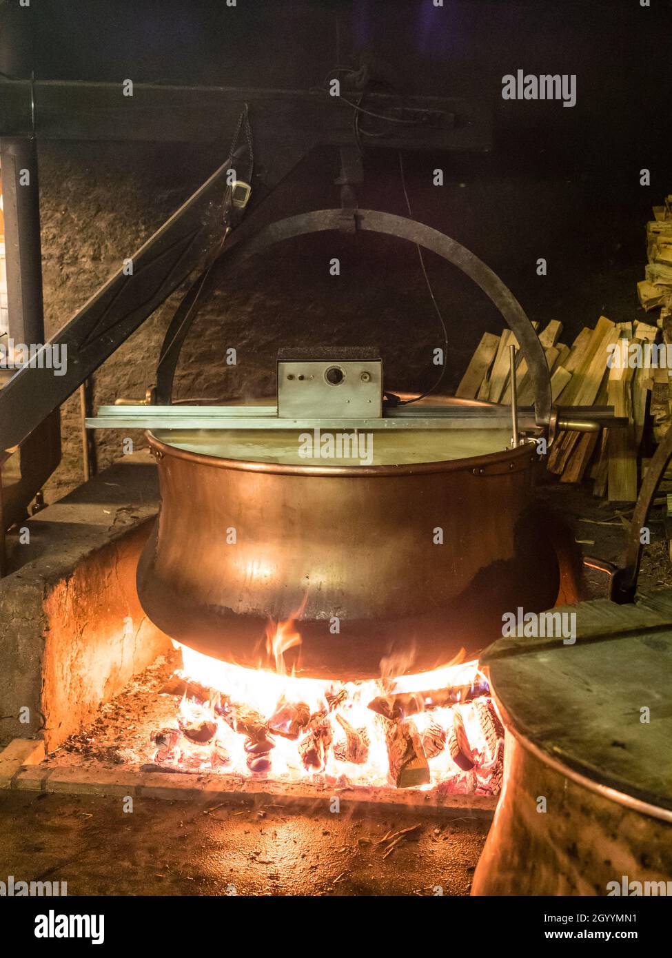 Traditional production of handmade Swiss Gruyere cheese at the alpine ...