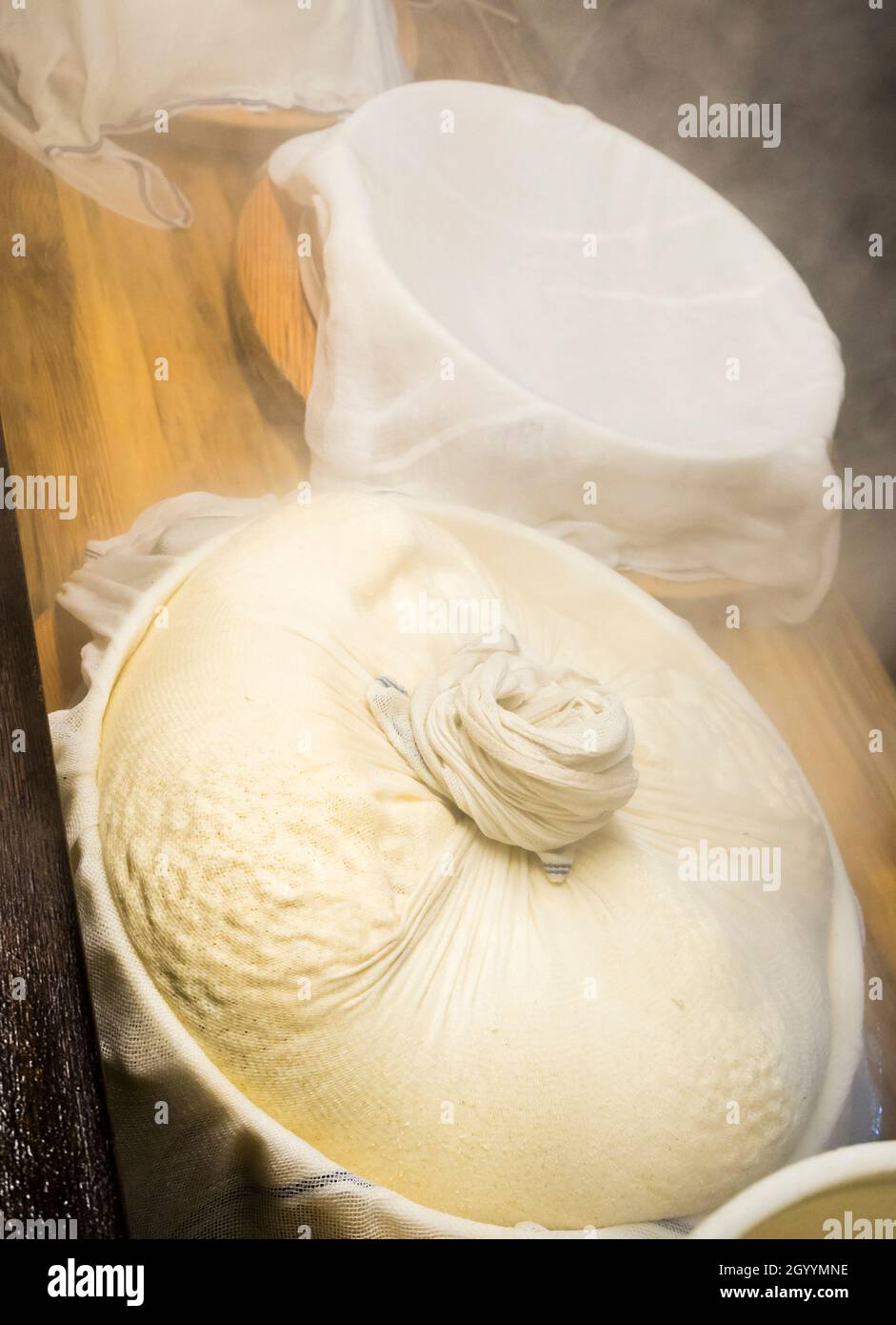 Traditional production of handmade Swiss Gruyere cheese at the alpine ...