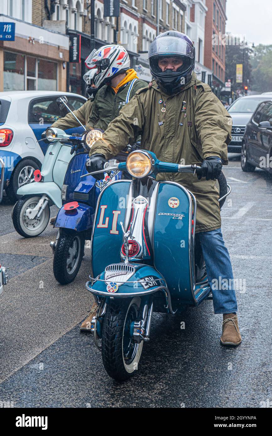WIMBLEDON LONDON, UK. 10 Oct, 2021. A group of Mods scooter riders on ...