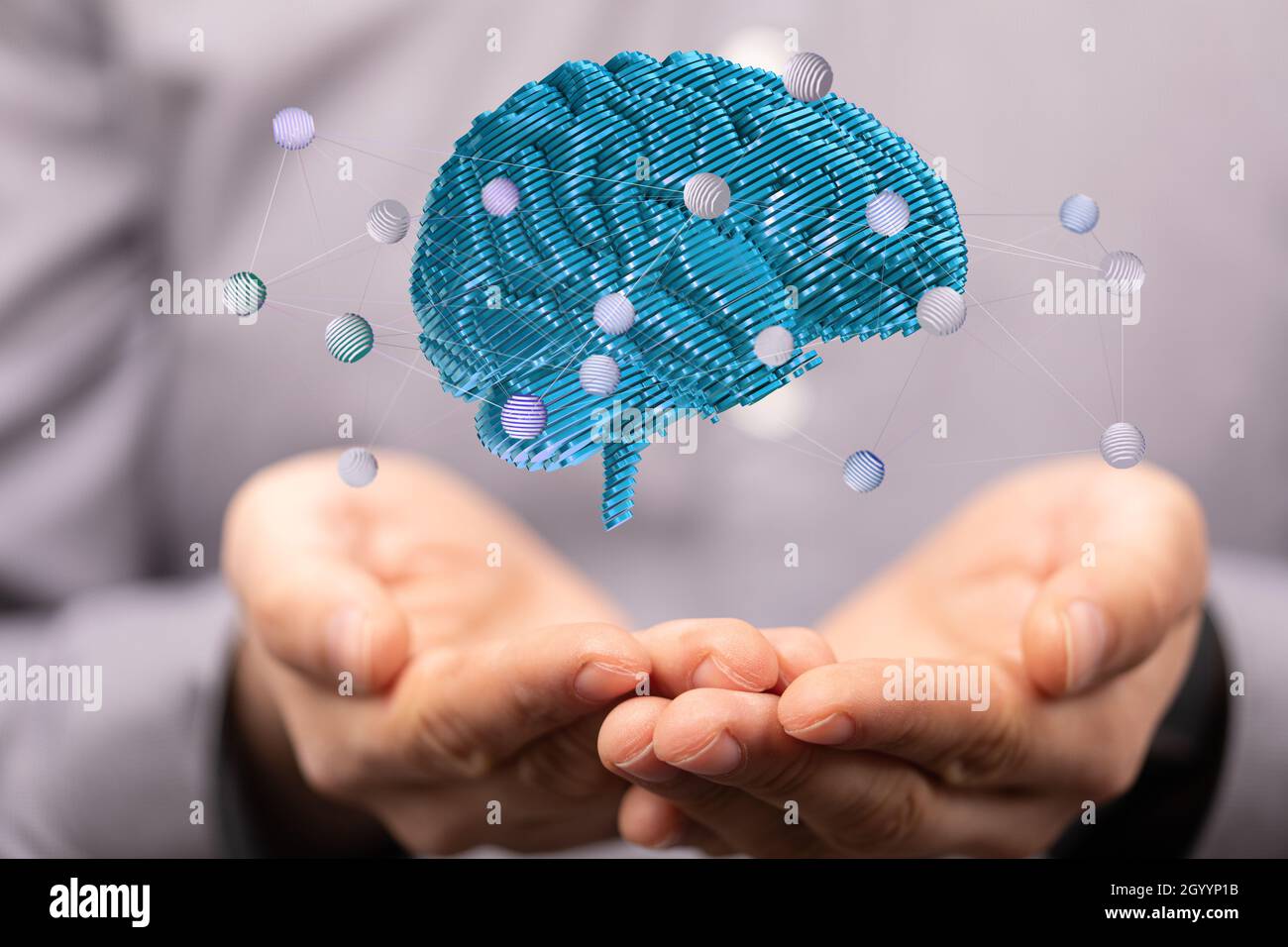 A floating 3D human brain icon above a hand - artificial intelligence ...