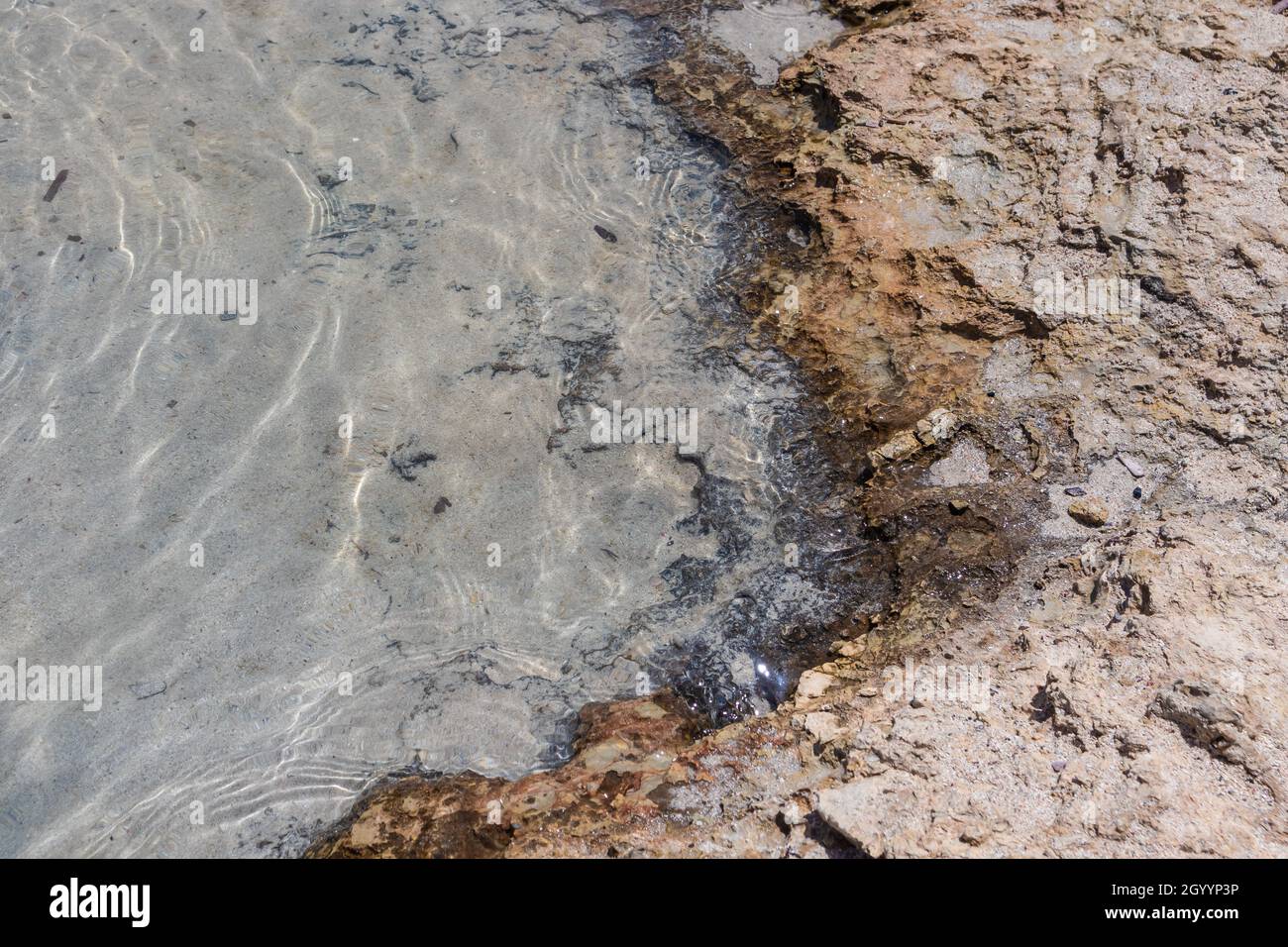Large rocks under the water in the sea Stock Photo - Alamy