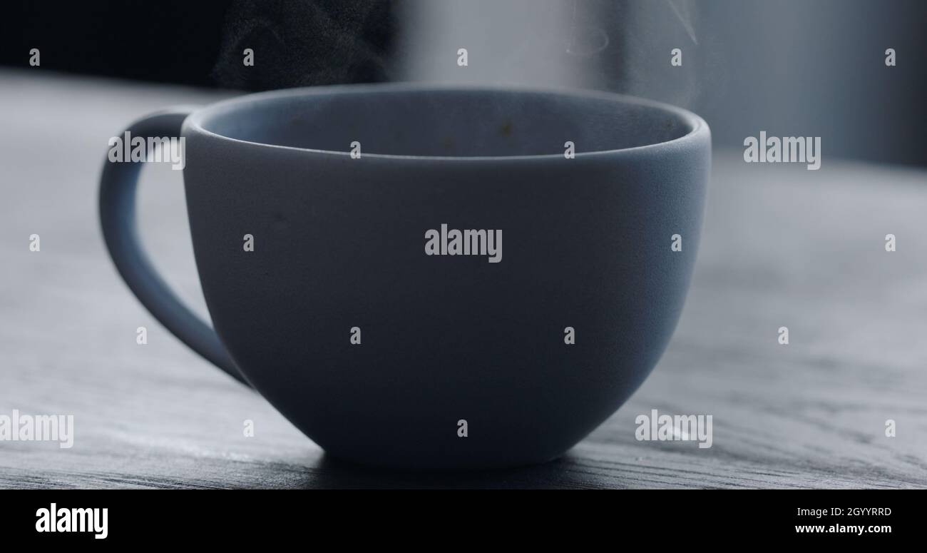 steam rising from blue cappuccino cup closeup, wide photo Stock Photo ...