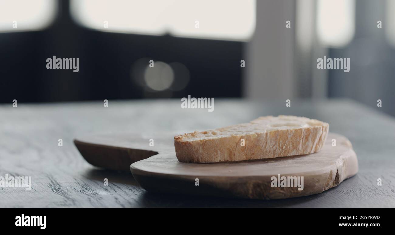 rustic bread slice on olive board, wide photo Stock Photo - Alamy