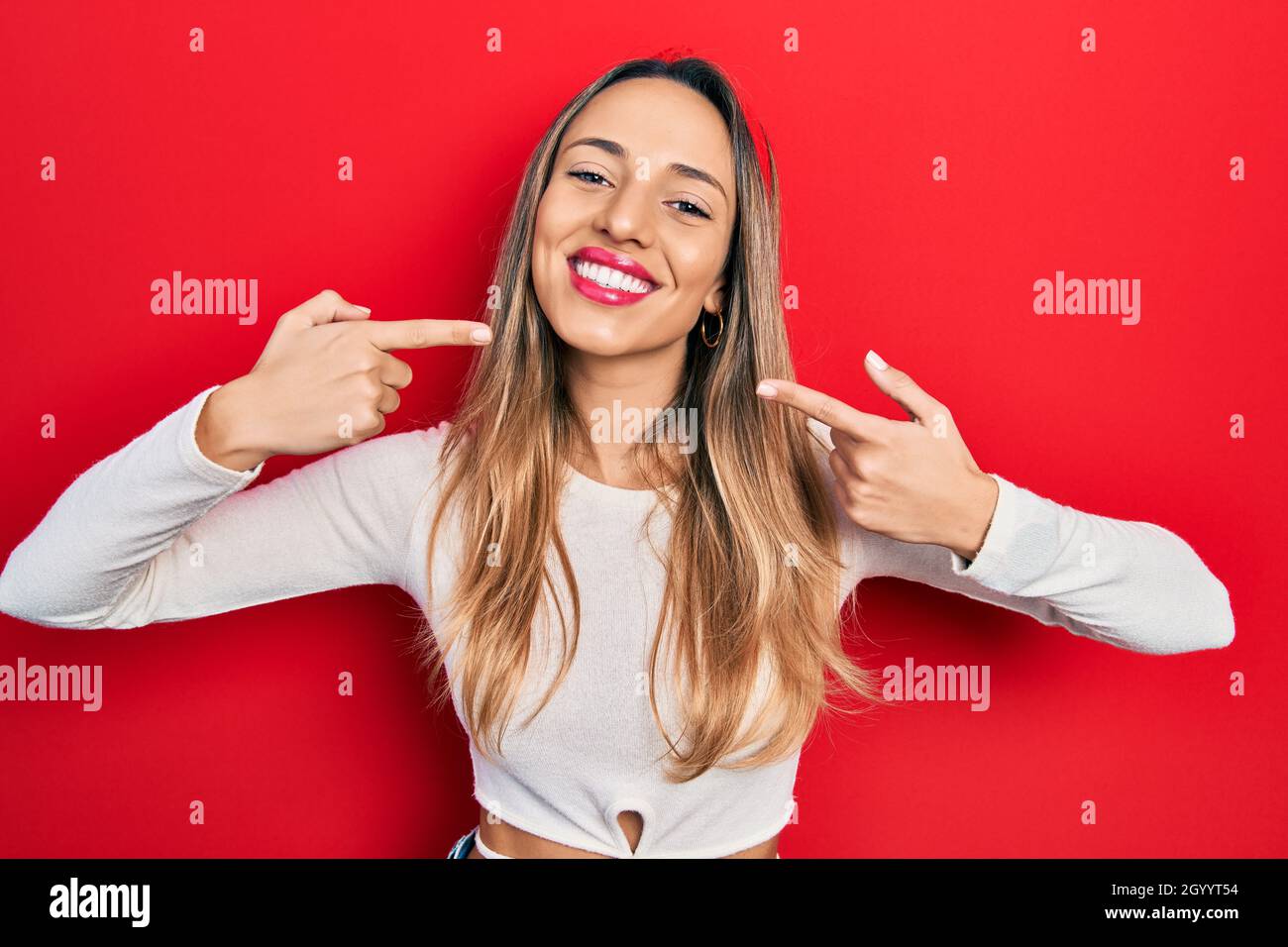 Beautiful hispanic woman wearing red diadem smiling cheerful showing ...