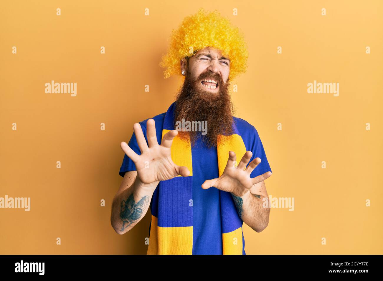 Redhead man with long beard football hooligan cheering game wearing ...