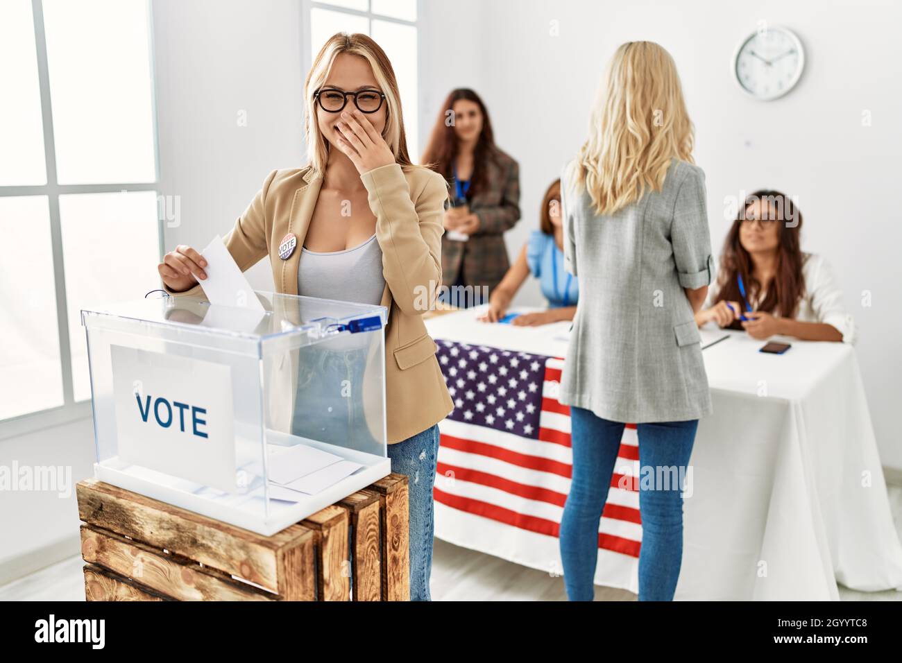 Group of young girls voting at democracy referendum laughing and ...