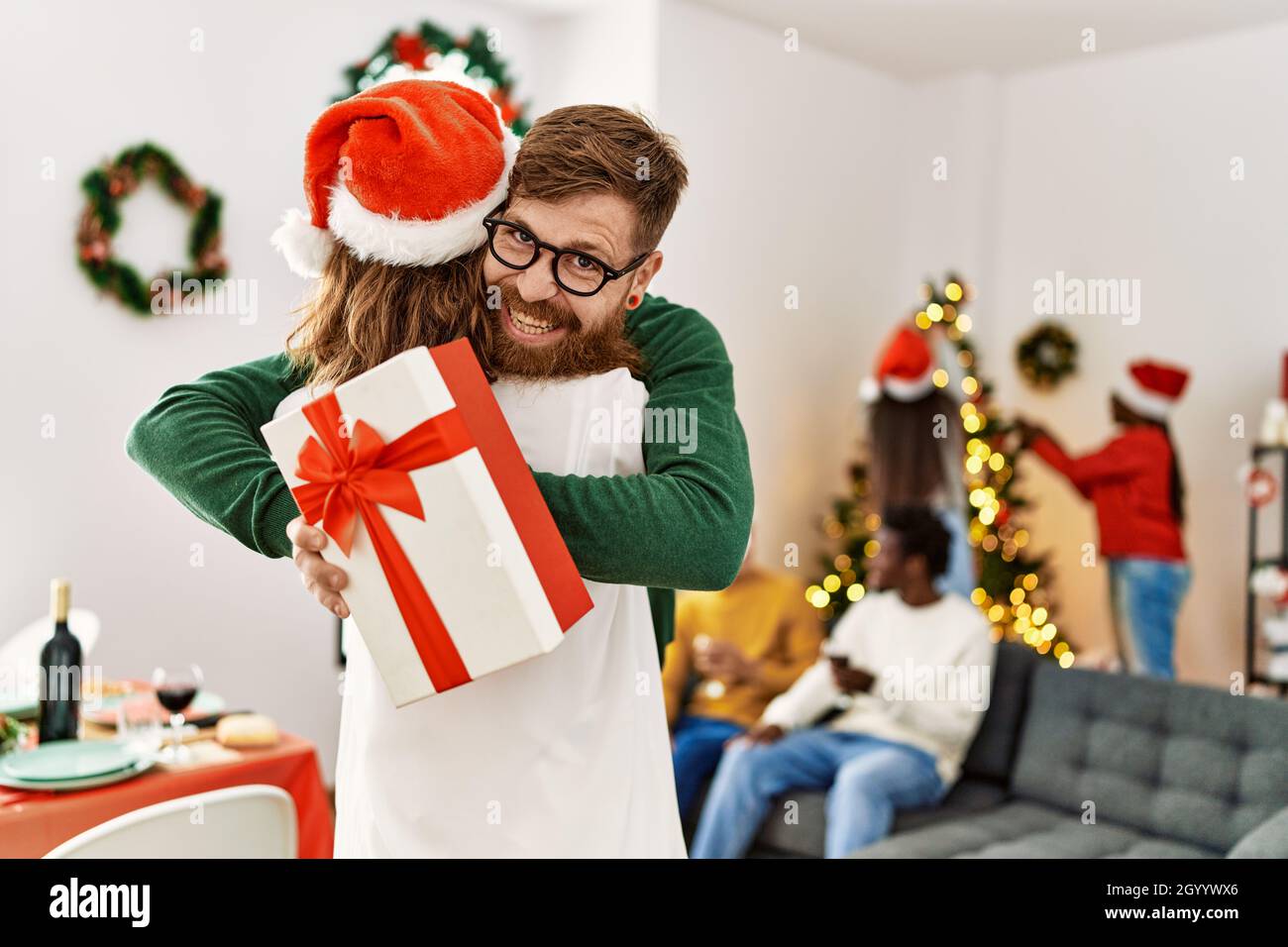 Surprised cheerful woman hugging gift hi-res stock photography and ...