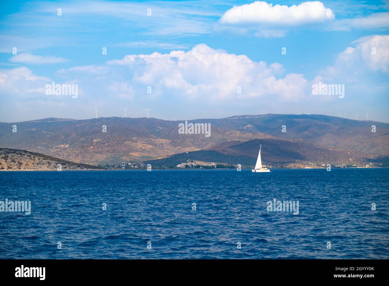 Catamaran sail Yacht cruising on deep blue sea water Stock Photo - Alamy