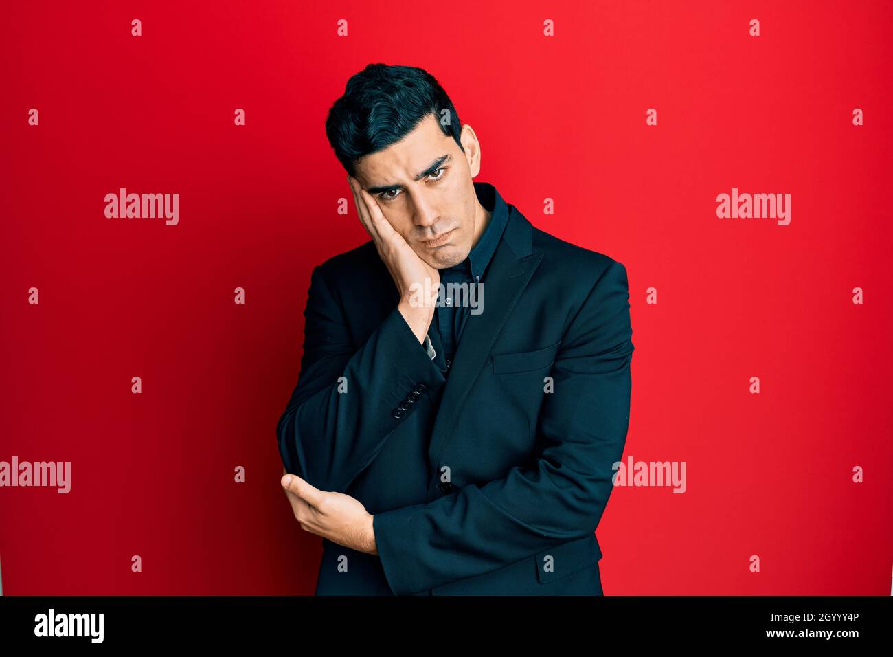 Handsome hispanic man wearing business clothes thinking looking tired ...