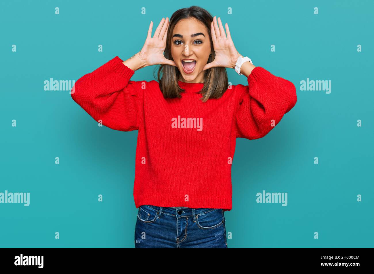 Beautiful brunette woman wearing casual winter sweater smiling cheerful ...
