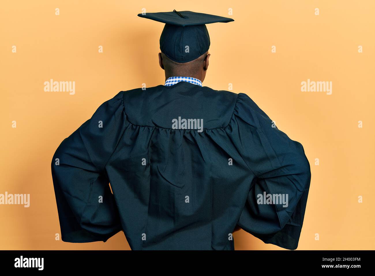 Young african american man wearing graduation cap and ceremony robe ...