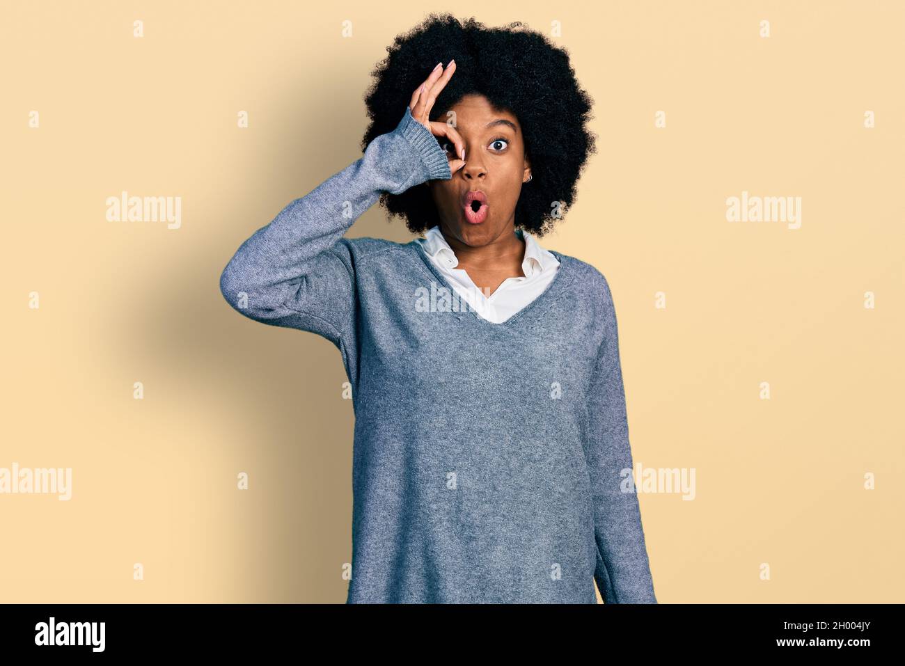 Young african american woman wearing business clothes doing ok gesture ...