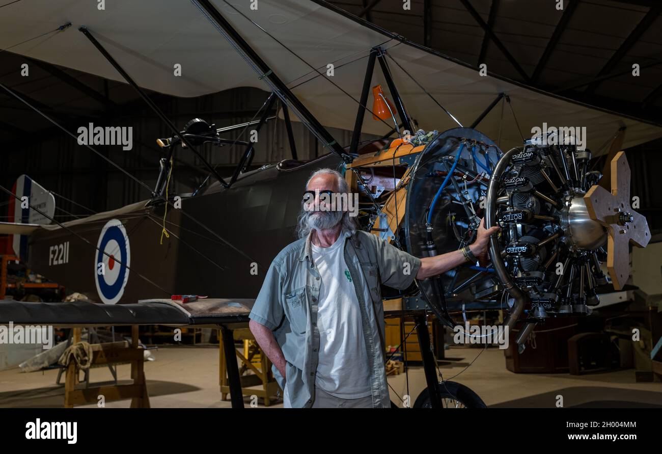 Senior man at replica WWI Sopwith 1 1/2 Strutter aeroplane biplane ...