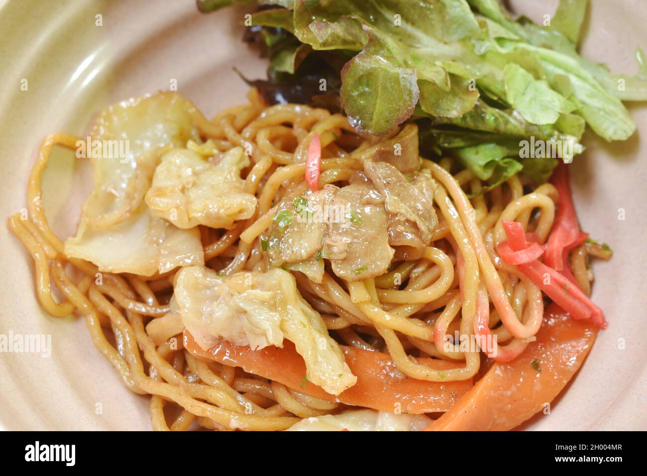 fried yakisoba Japanese noodles slice pork and cabbage with carrot on ...