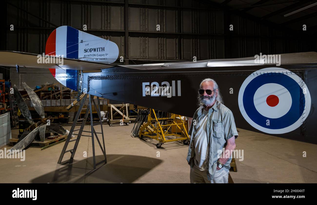 Senior man at replica WWI Sopwith 1 1/2 Strutter aeroplane biplane ...