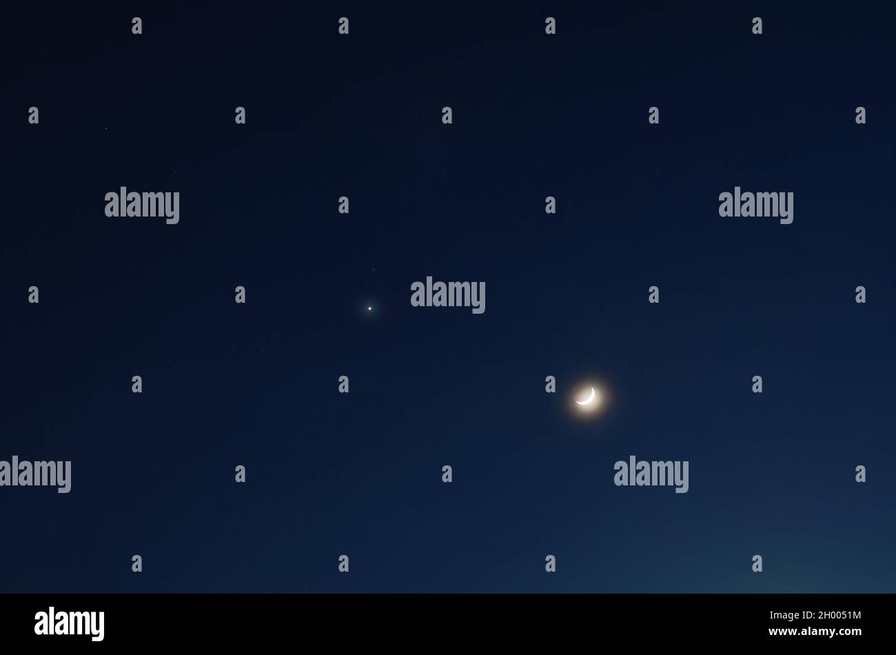half moon and Venus arranging on sky in twilight dusk Stock Photo - Alamy