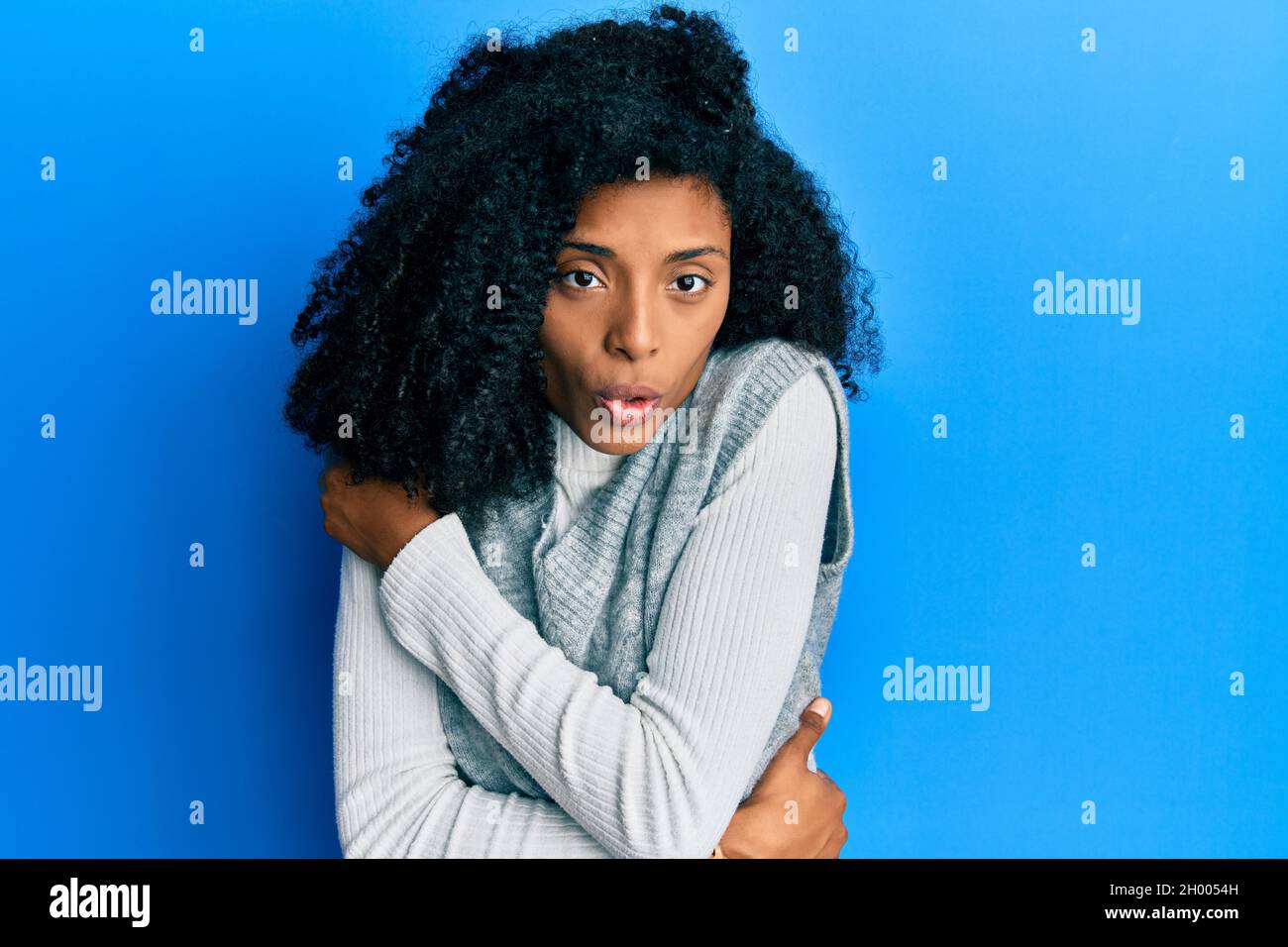 African american woman with afro hair wearing casual winter sweater ...