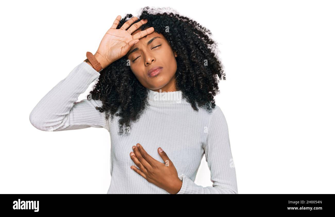 Young african american girl wearing casual clothes touching forehead ...