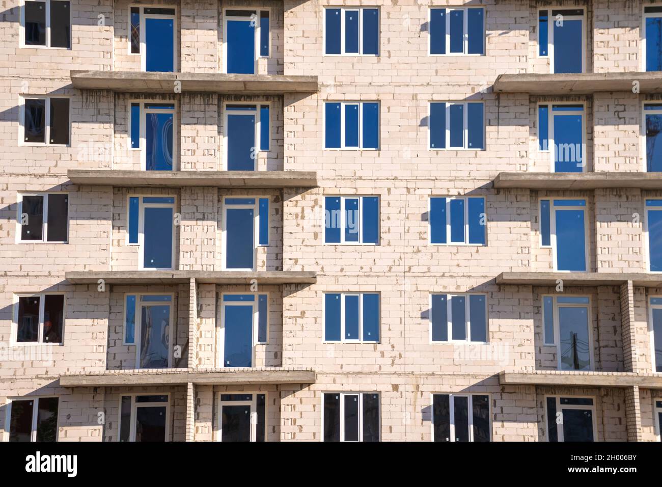 Brick walls of residential building under construction. Real estate ...