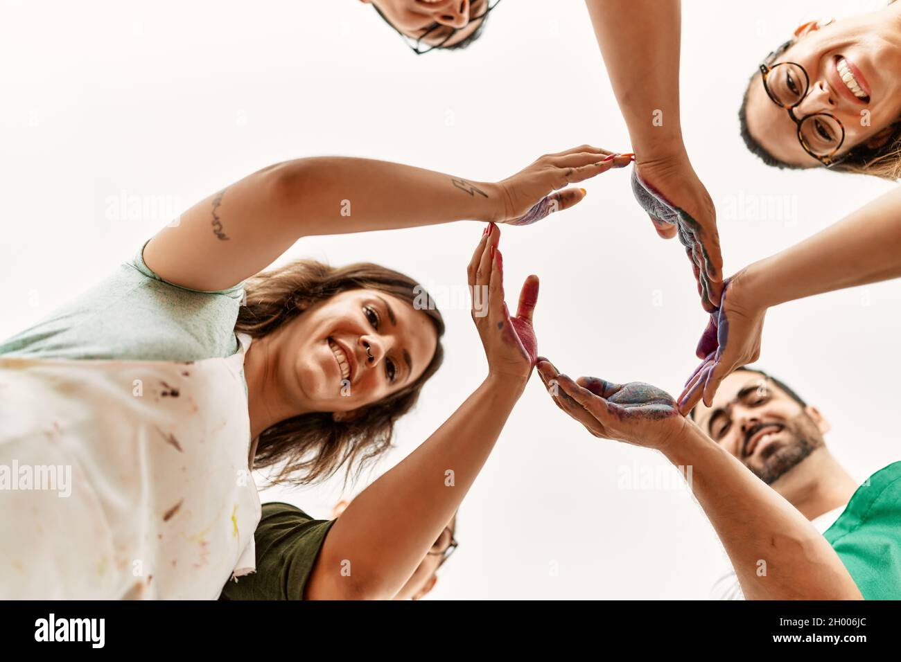 Group of people smiling happy with hands together art studio Stock ...