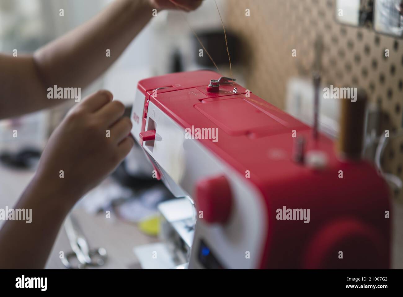 A person working with a sewing machine Stock Photo - Alamy