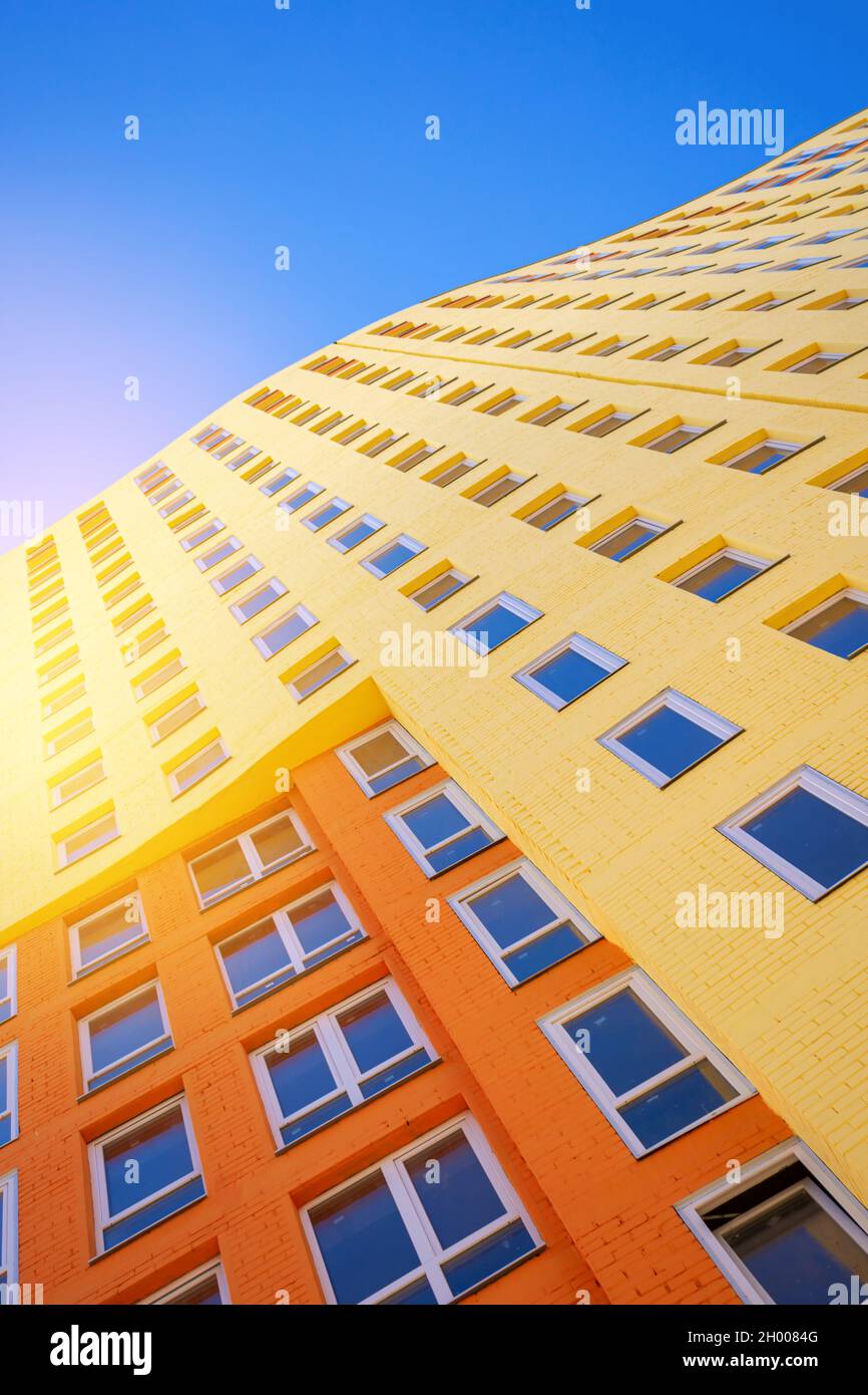 Modern European multi-storey building with many glass windows standing ...