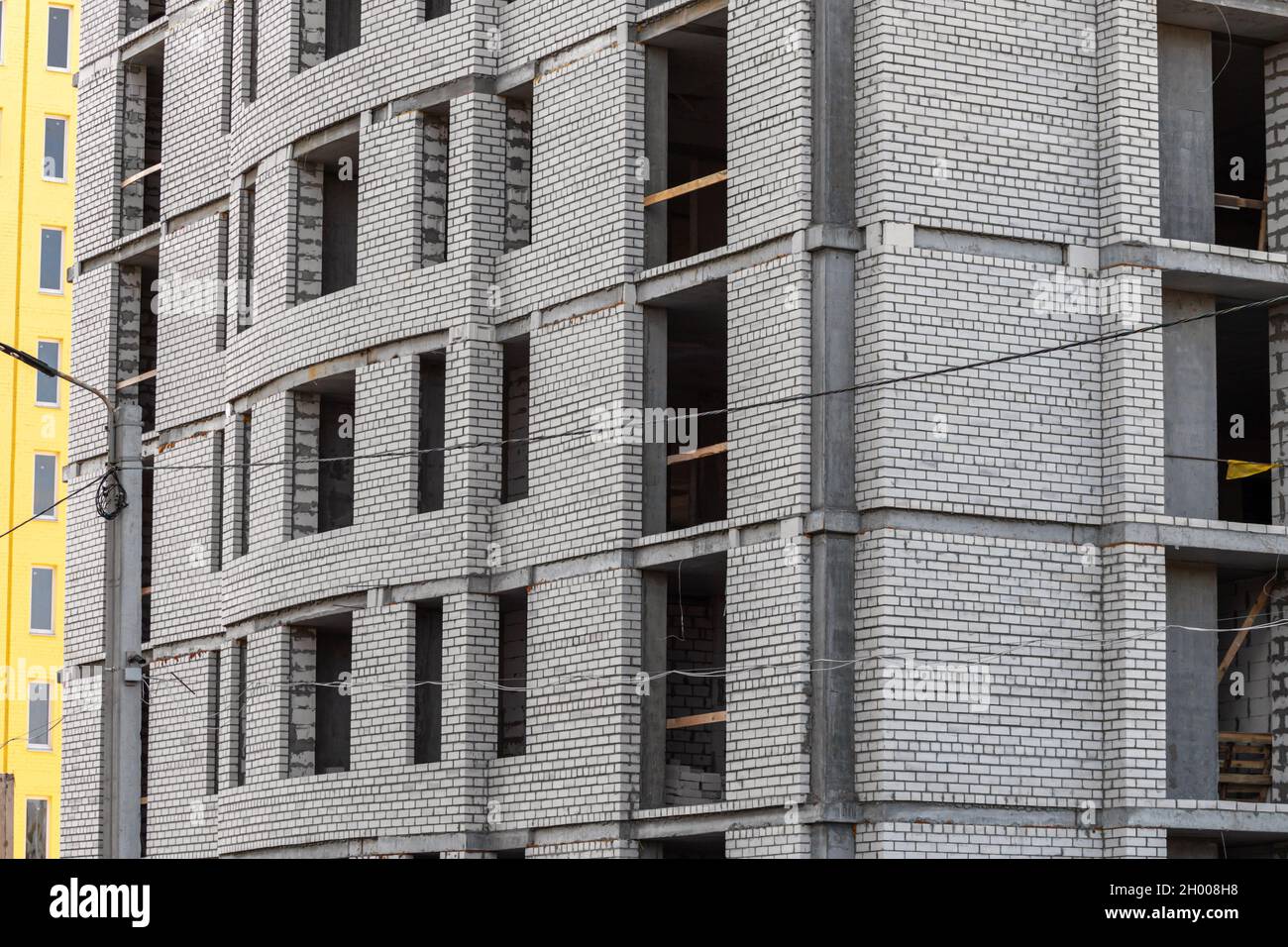 Residential building construction site. Brick walls of a new building ...