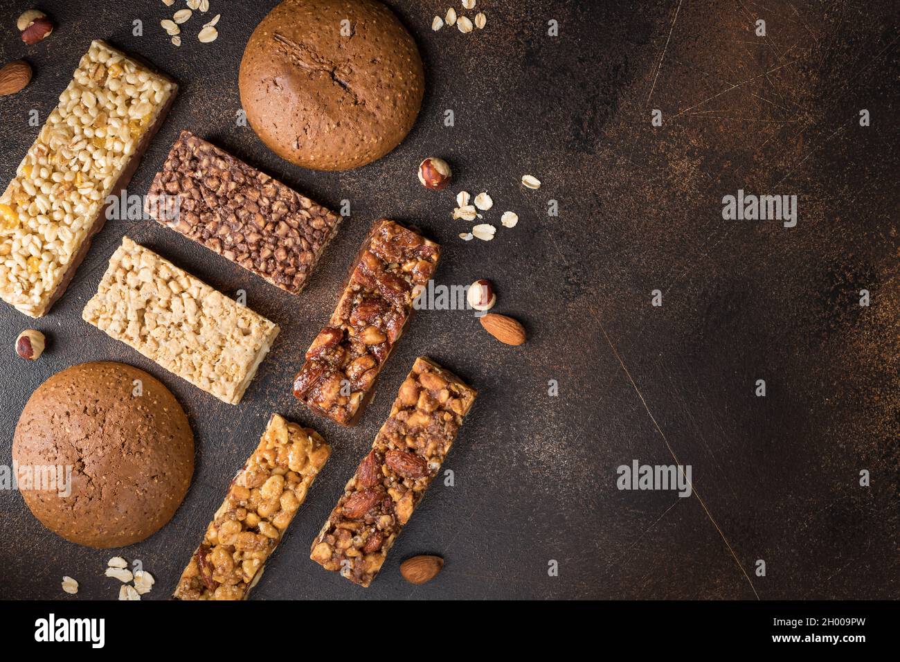 Different energy protein bars on dark background Stock Photo - Alamy