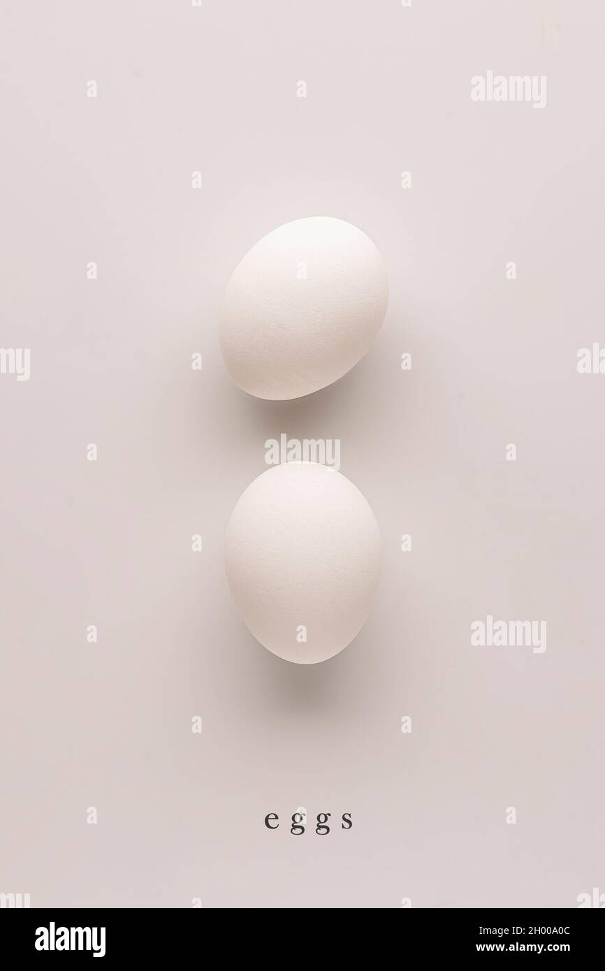 two eggs in a shell on a white background. graphic photo for interior ...