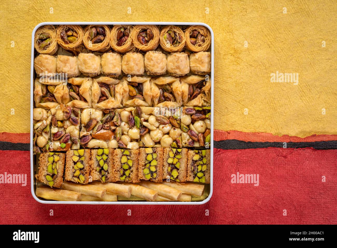 assortment of traditional Turkish baklava pastry in a tin box, a ...