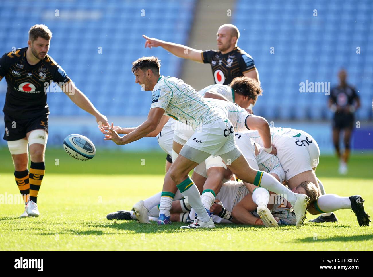 Northampton Saints' Alex Mitchell passes back during the Gallagher ...