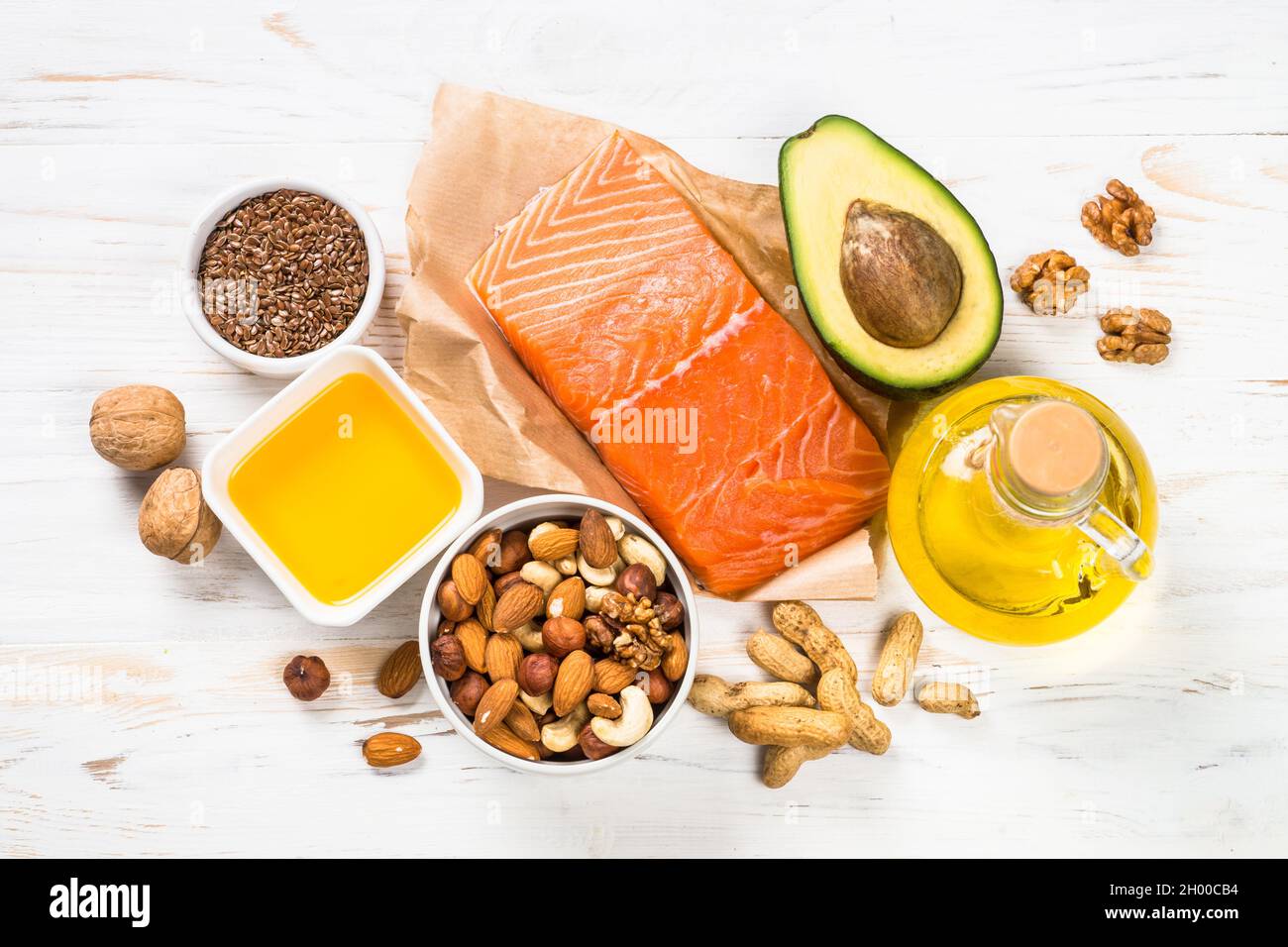 Healthy fats products at black background Stock Photo - Alamy