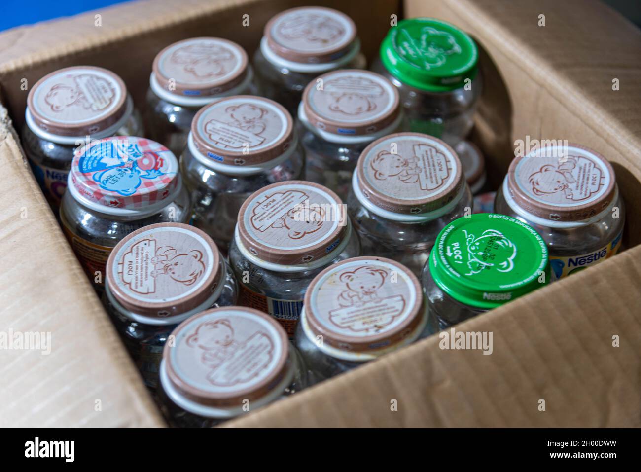 Empty pots of baby food. Glasses packaged in a cardboard box. Objects ...