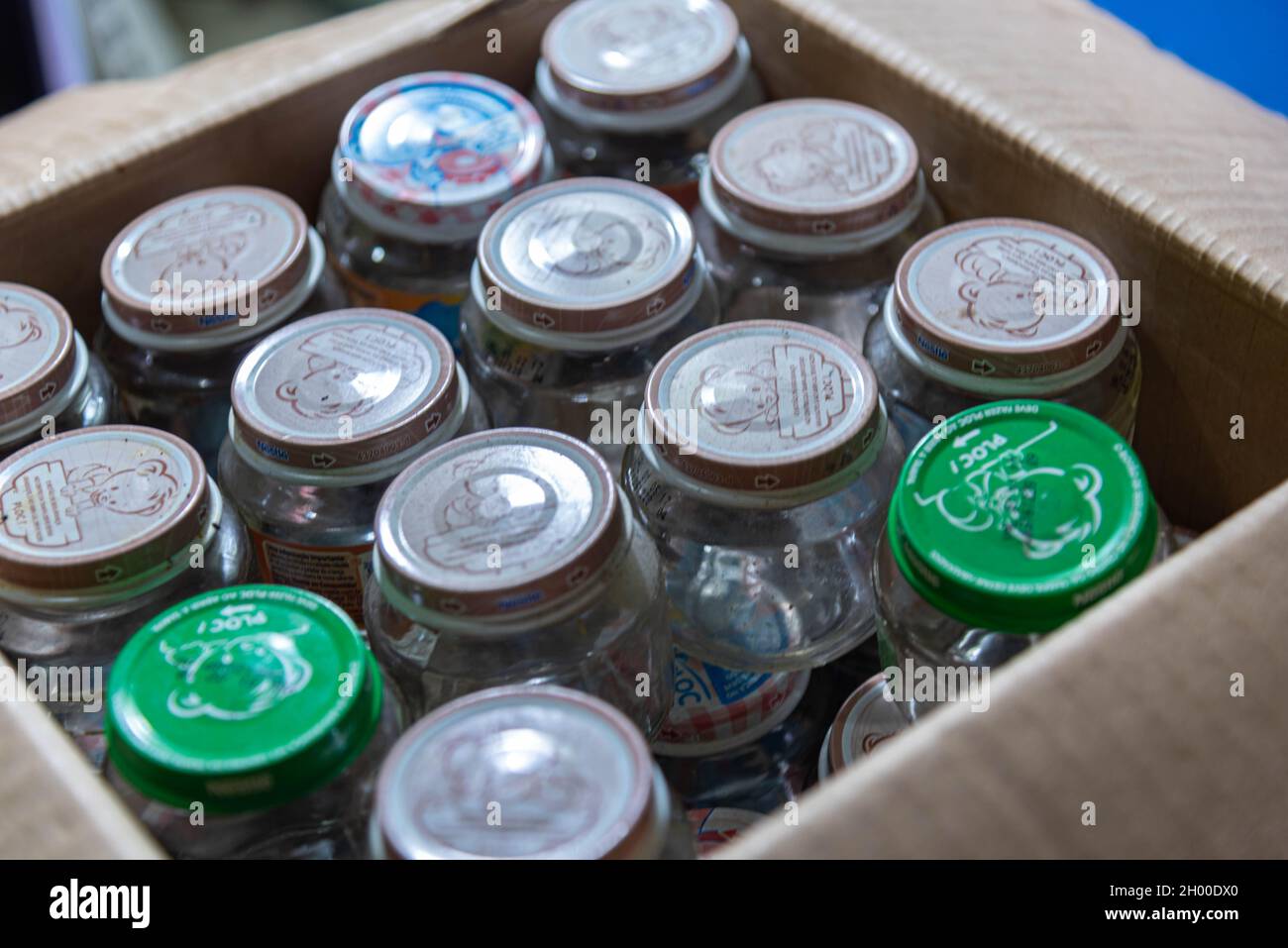 Empty pots of baby food. Glasses packaged in a cardboard box. Objects ...