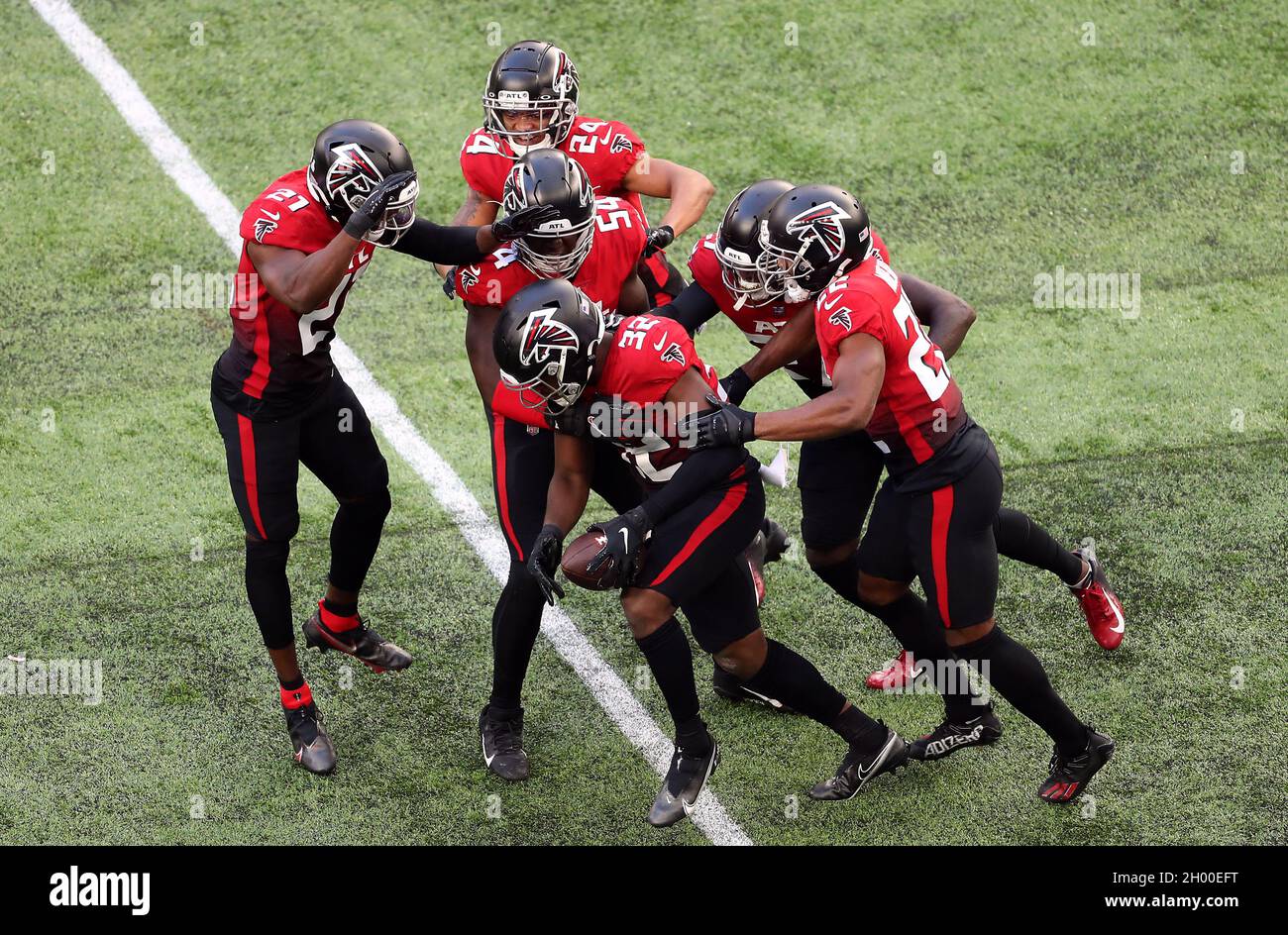 Atlanta Falcons Jaylinn Hawkins celebrates an interception with team ...