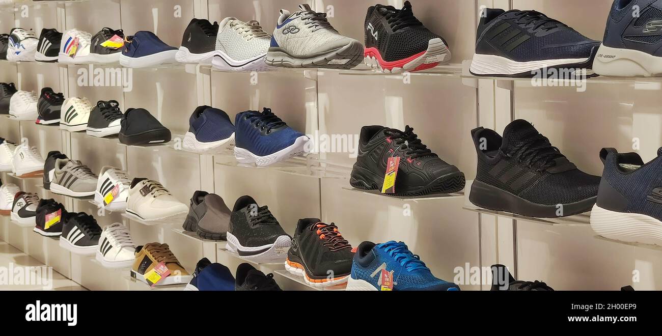 Department store. Men's shoes for sale; Object display gondola. Items ...