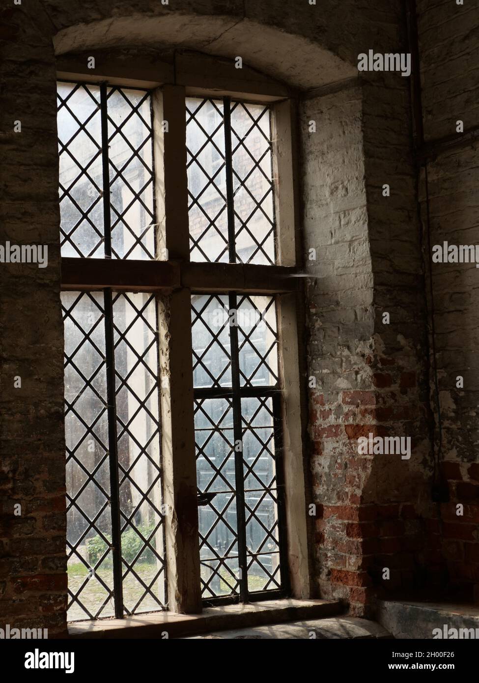 A latticed window inside an old stone building Stock Photo - Alamy