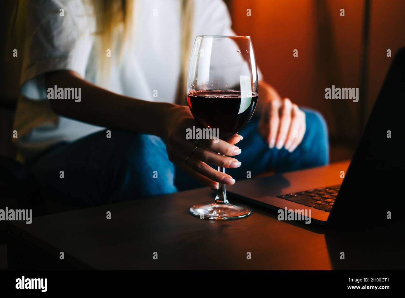 Young millennial woman having video call on laptop computer and ...