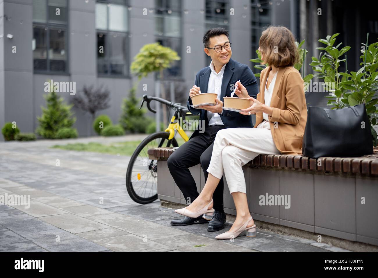 Business people having lunch at work in city Stock Photo - Alamy